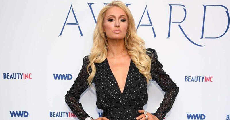 Paris Hilton suffers wardrobe malfunction as she exposes too much in metallic dress with ...