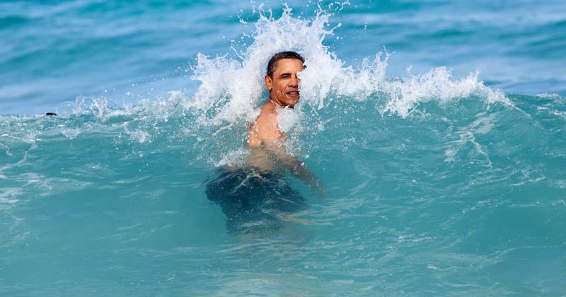 Barack Obama spotted shirtless as he paddleboards solo in the Pacific ...
